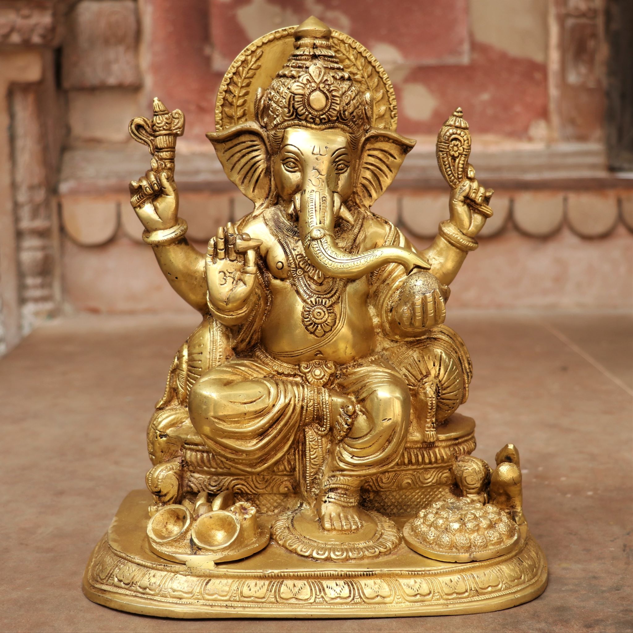 Brass golden ganesha with laddu thali - Buy exclusive brass statues ...